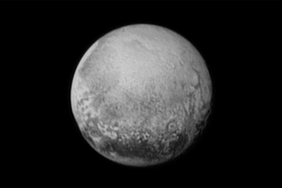 Cliffs, craters, mysterious dark areas: New photos of Pluto from New ...